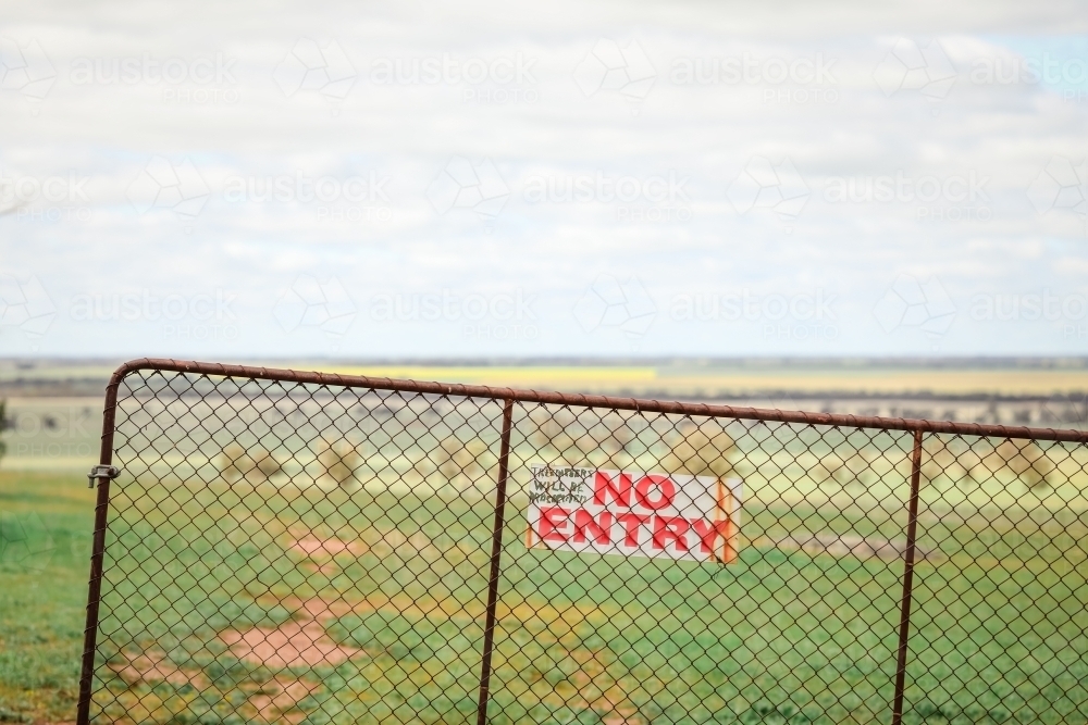 Image of No Entry sign on rustic farm gate with view of fields in ...