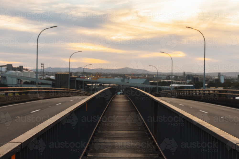Image of no focus walkway across top of Stockton Bridge with Newcastle ...