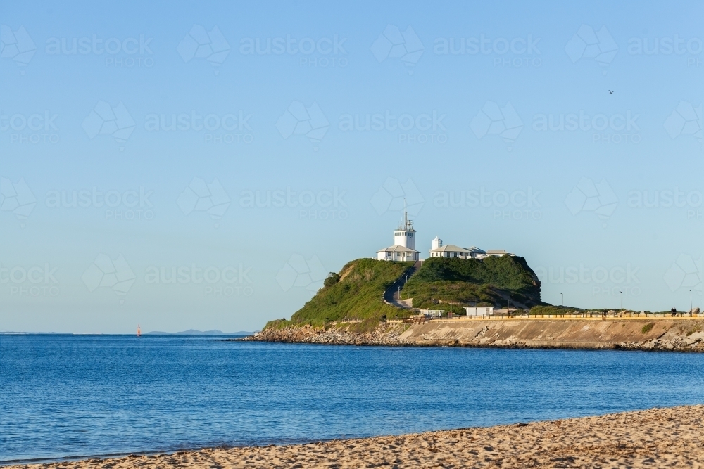 Image of Nobbys Head Lighthouse across water of river estuary ...