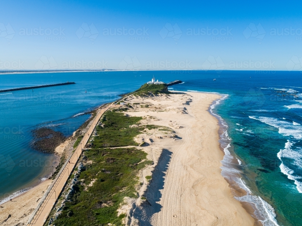 Image of Nobbys Lighthouse and headland to blue ocean where the Hunter ...