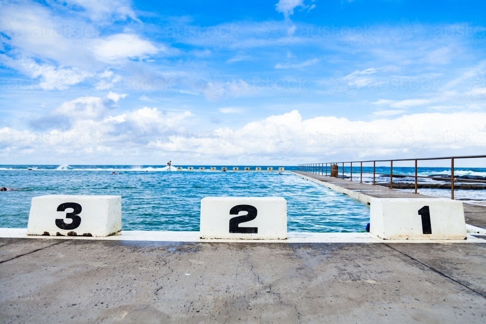Image of Numbered swimming lanes at ocean pool - Austockphoto