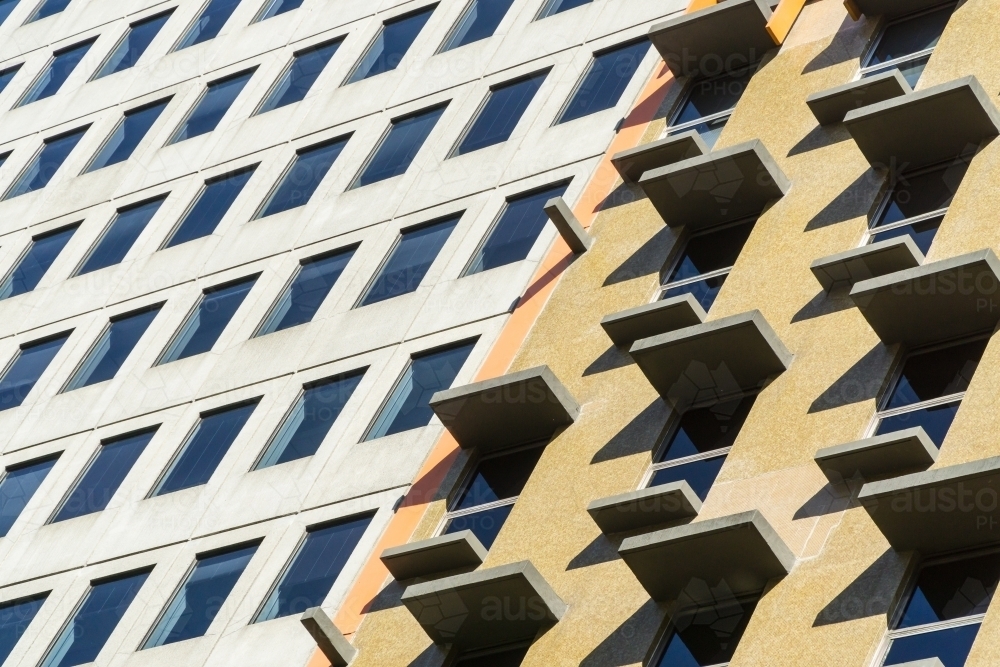 Image of Oblique view of windows and ledges on the facade of a building ...