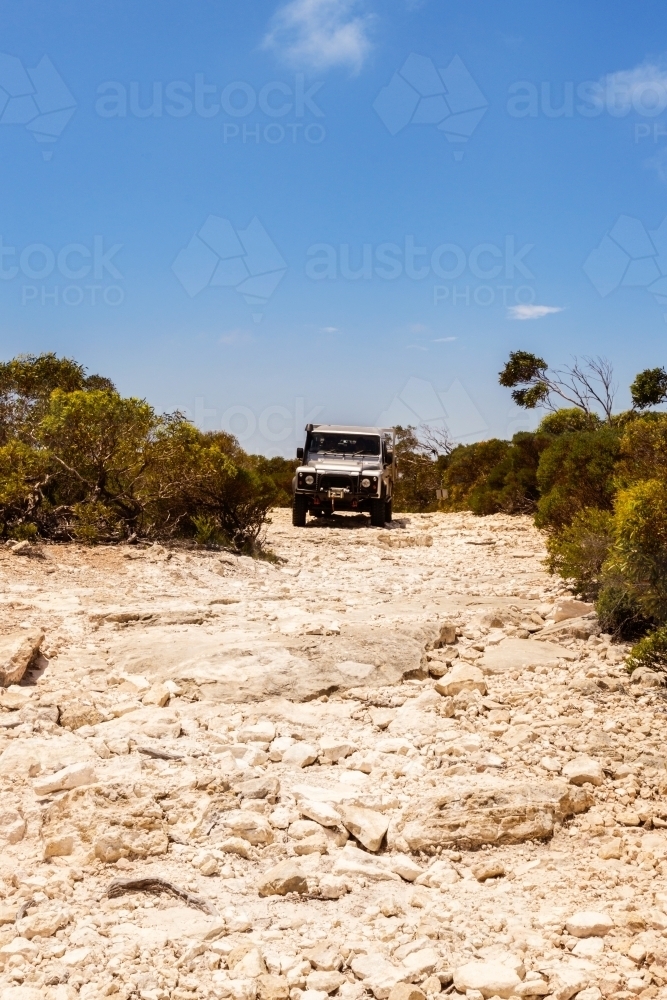 Image of offroading in a Land Rover Defender - Austockphoto