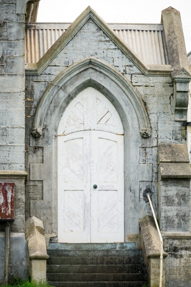 Image of Old church doorway and steps in a country town - Austockphoto