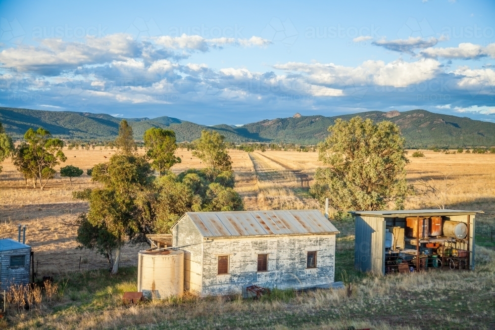 Image of Old farm sheds in the evening light - Austockphoto