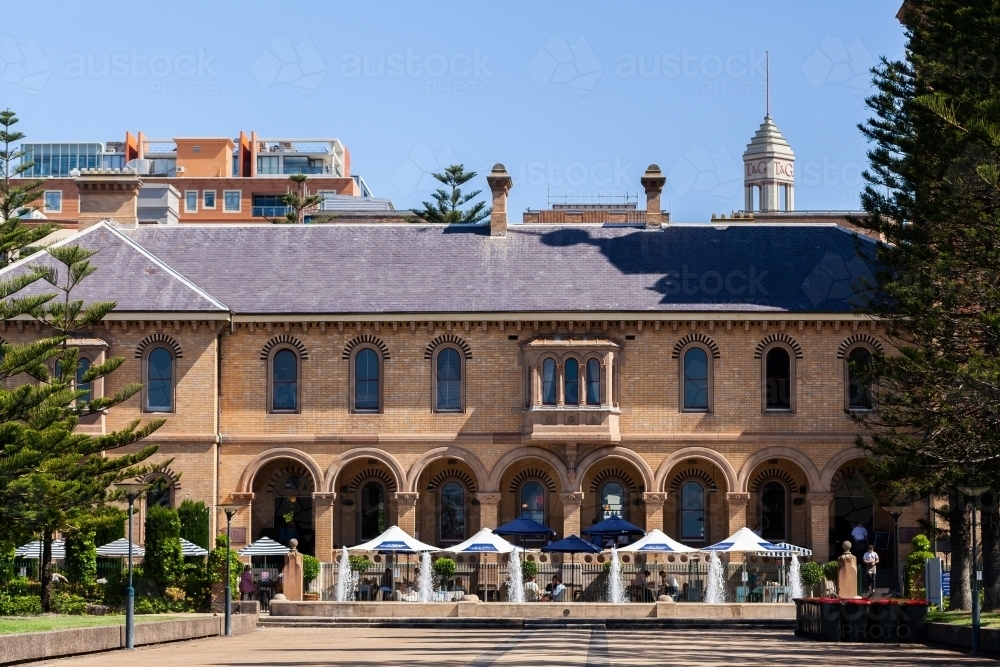 Image of Old historical customs house hotel building with café in front ...