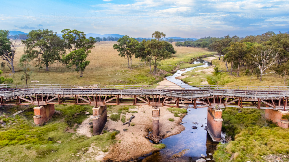 Image of Old Railway Bridge over a creek crossing - Austockphoto