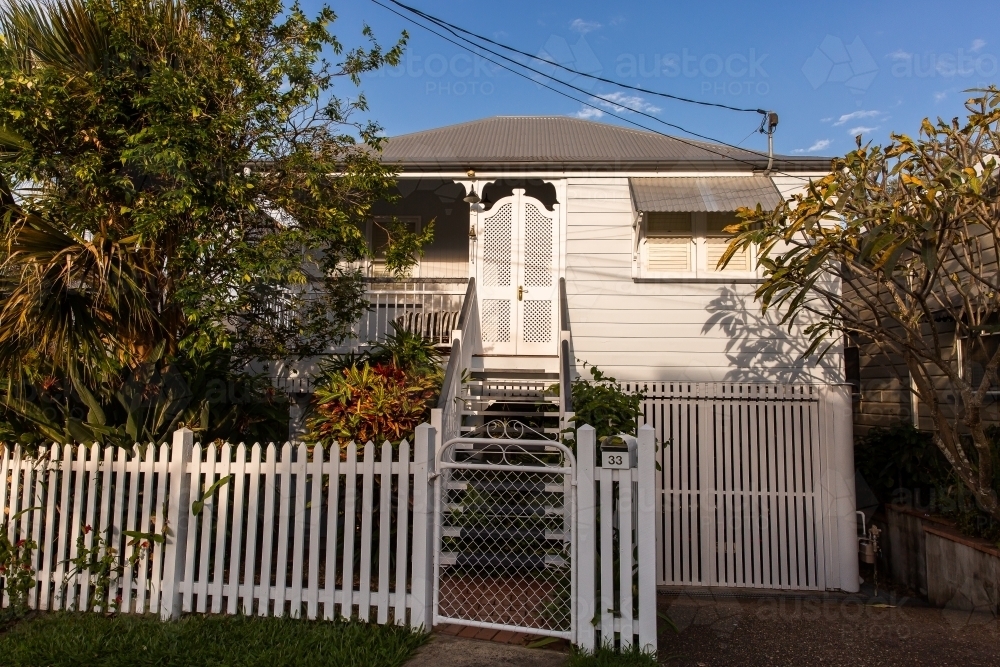 Image of old raised timber house in suburban Brisbane on a sunny ...