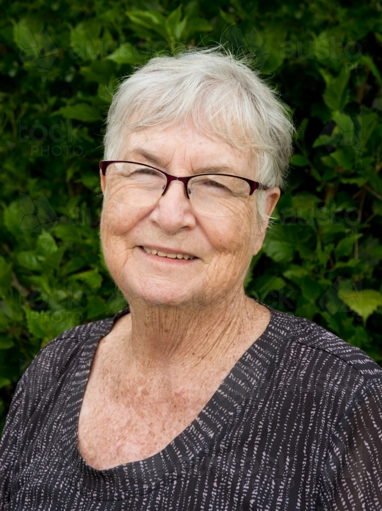 Image of Older lady looking at camera outdoors smiling. - Austockphoto