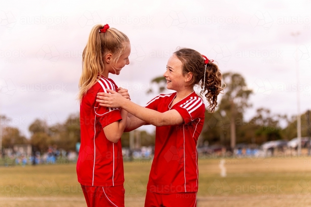 Image of One girl team member reassuring her friend before a match ...