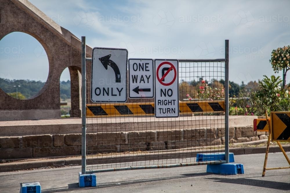 Image of One way, road closed ,road work signs - Austockphoto
