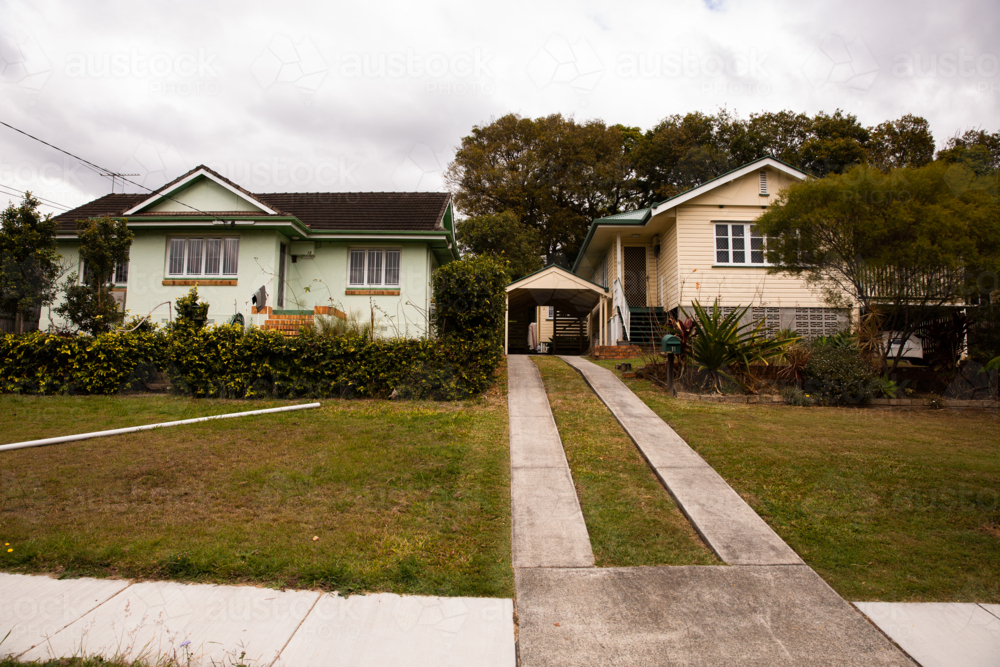 Image of original houses in suburban Brisbane with driveway - Austockphoto
