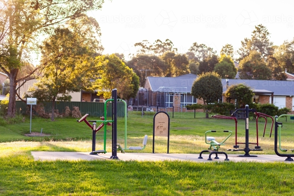 Image of Outdoor public exercise equipment at park in afternoon light ...