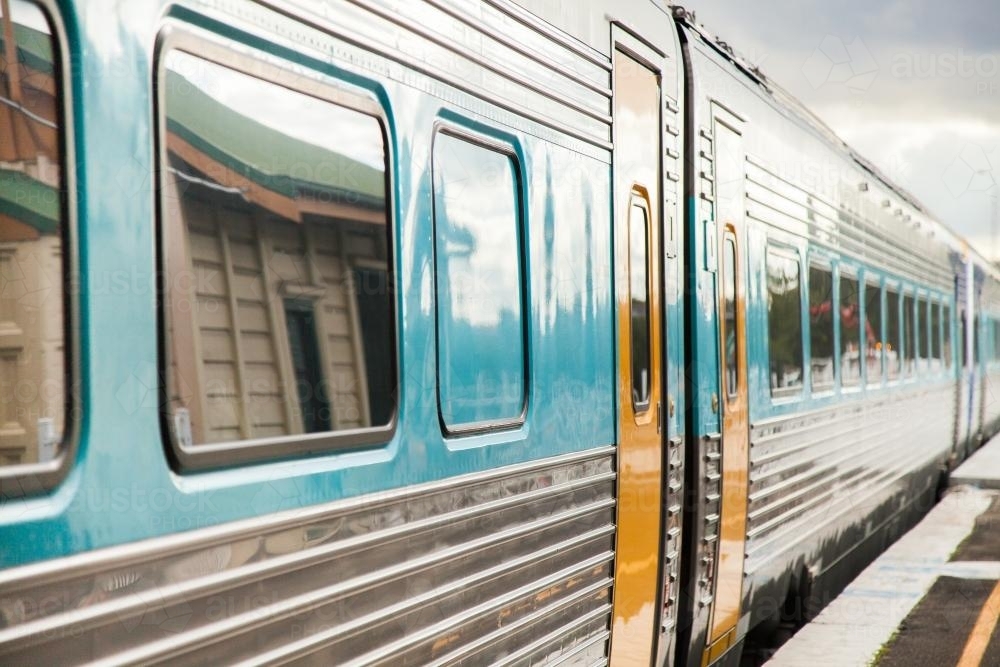 Image of Outside close up of a passenger train carriage - Austockphoto