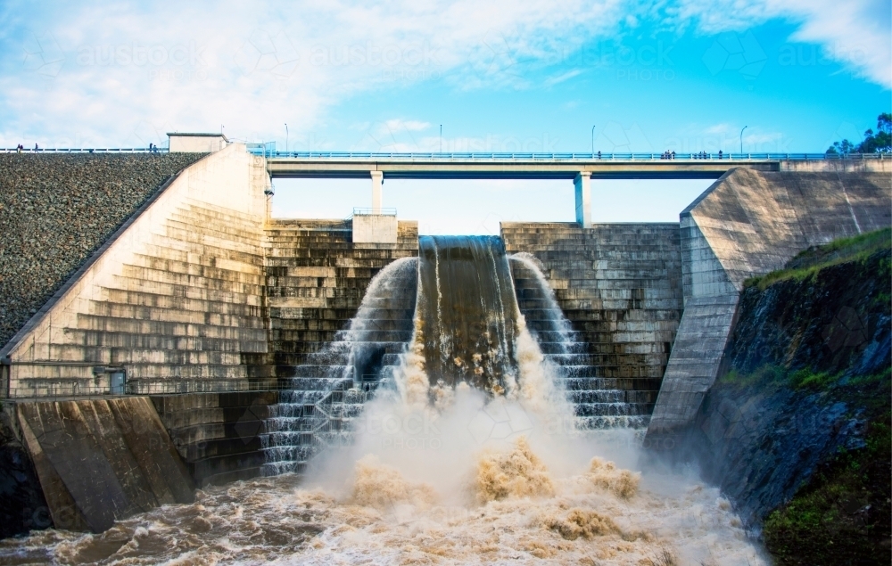 Image of Overflowing weir with gushing water after floods - Austockphoto