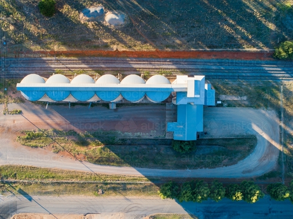 Image of Overhead aerial photo of grain silos next to train line ...