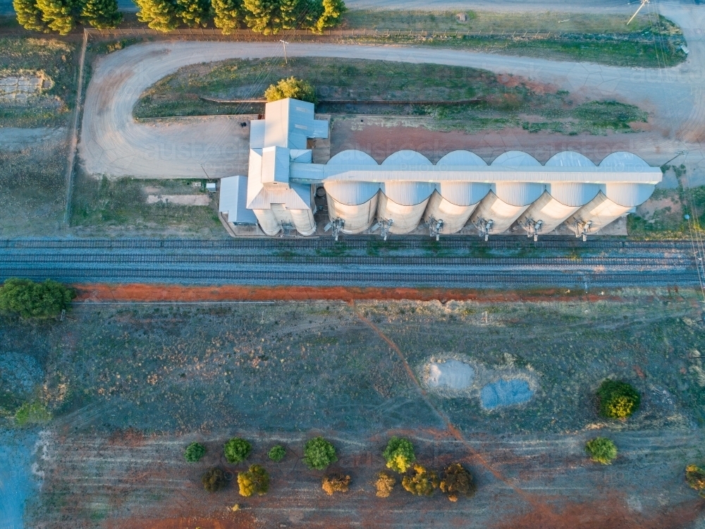 Image of Overhead aerial photo of grain silos next to train line ...