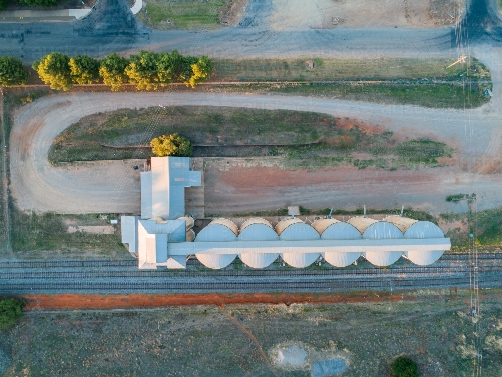 Image of Overhead aerial photo of grain silos next to train line ...
