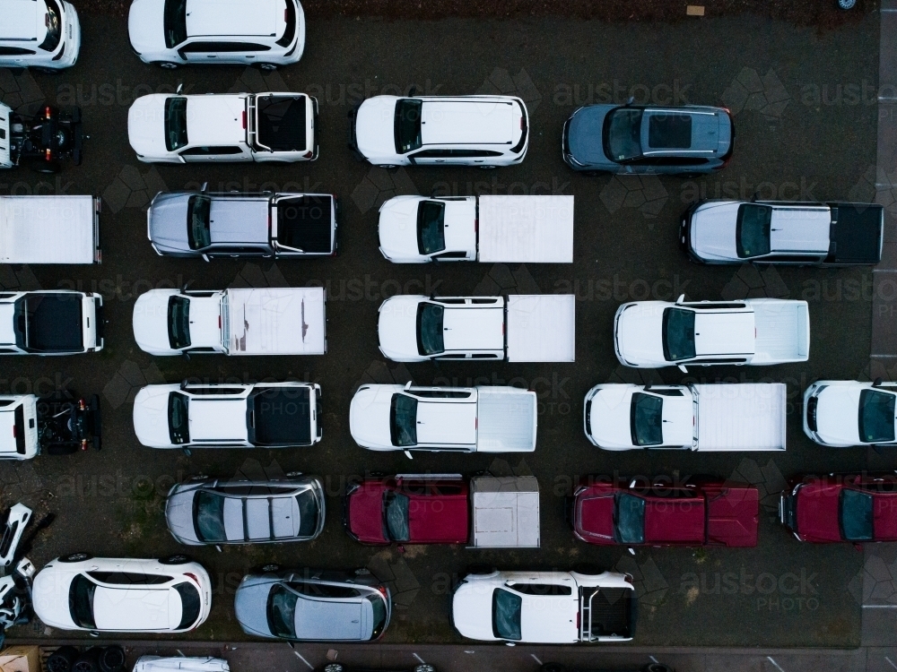 Image of Overhead aerial view of full car lot with parked vehicles ...