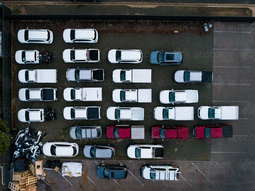 Image of Overhead aerial view of full car lot with parked vehicles ...