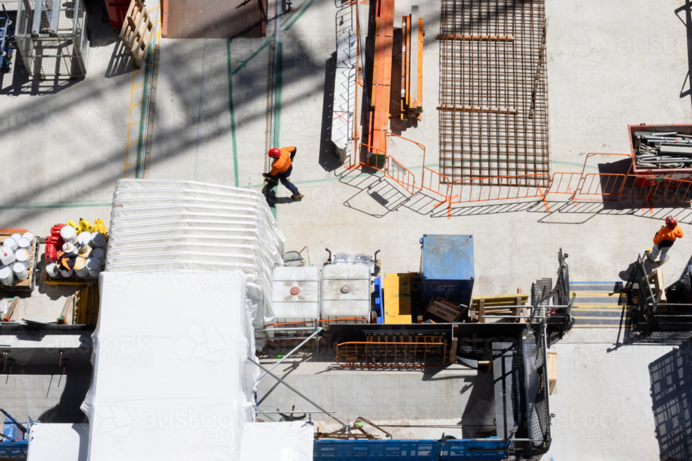Image of Overhead view of a construction site with construction worker ...