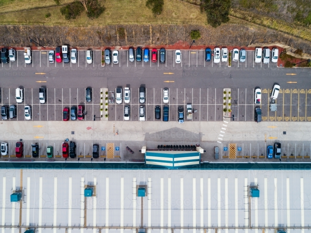 Image of overhead view of customers parking in carpark beside hardware ...