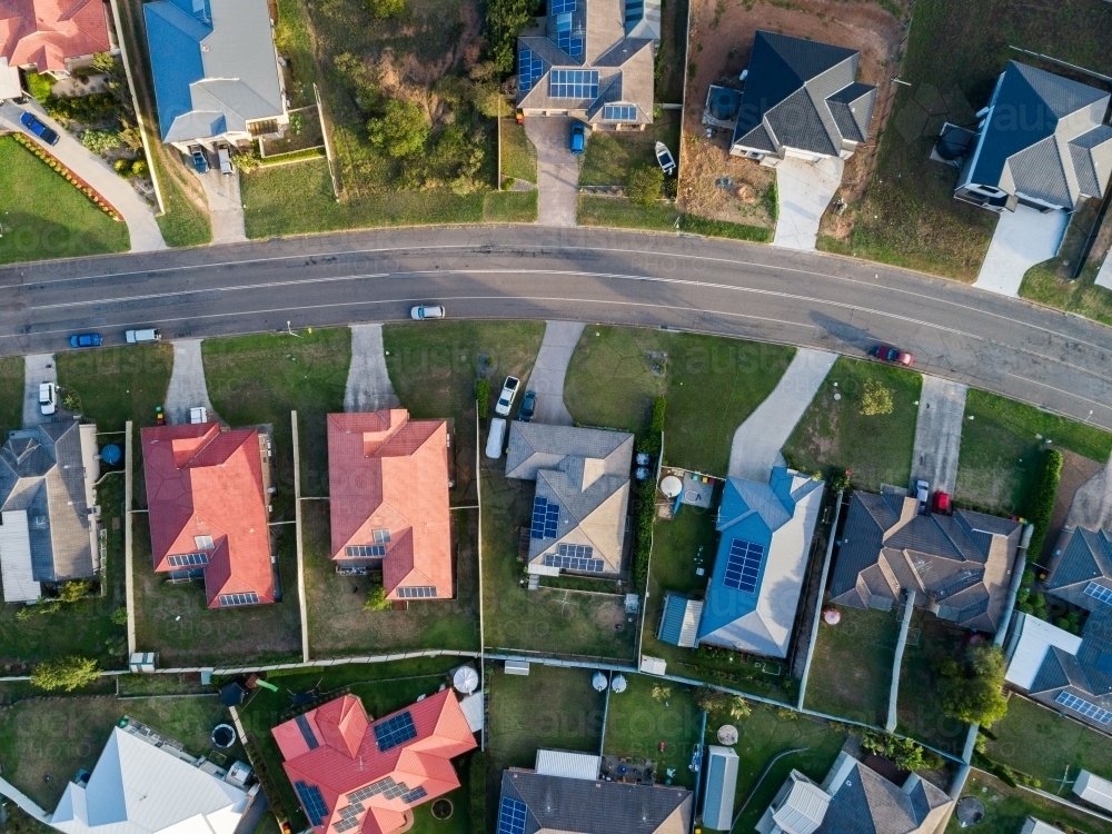 Image of Overhead view of houses and driveways to road - Austockphoto