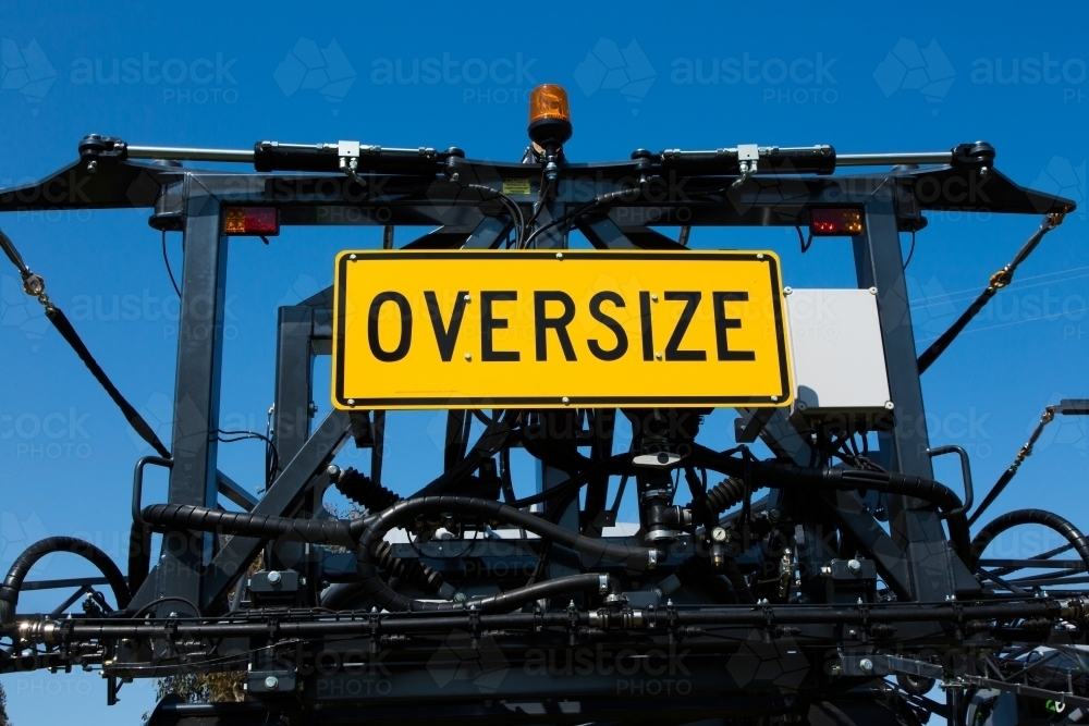 Image of Oversize sign on a piece of agricultural machinery - Austockphoto