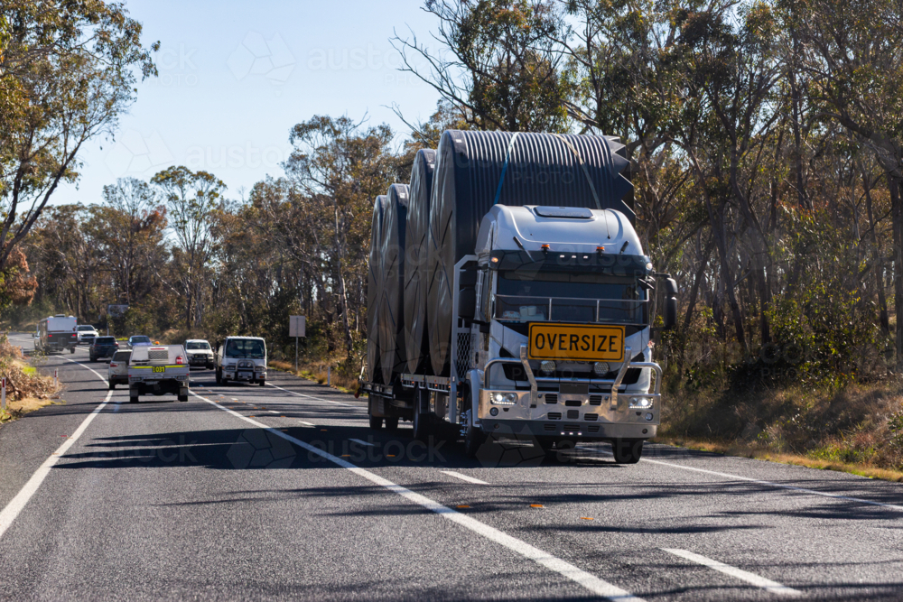 Image of oversized load on truck carrying water tanks along Australian ...