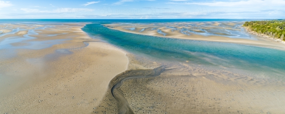 Image of Panorama of coastline with ripples and patterns in the sand ...