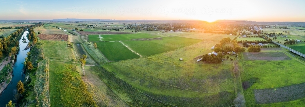 Image of Panoramic aerial view of green farm paddocks beside Hunter ...