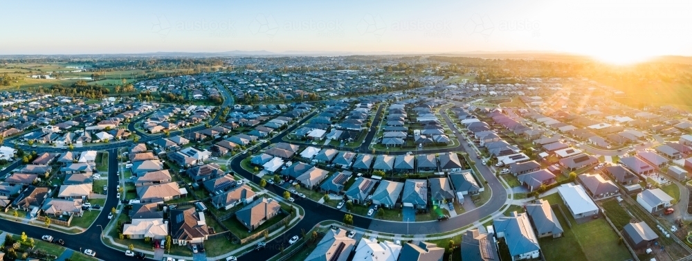 Image of Panoramic view of sunset over houses in residential suburb ...