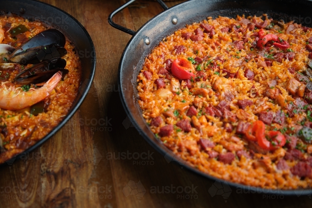 Image of Pans of Spanish paella - Austockphoto