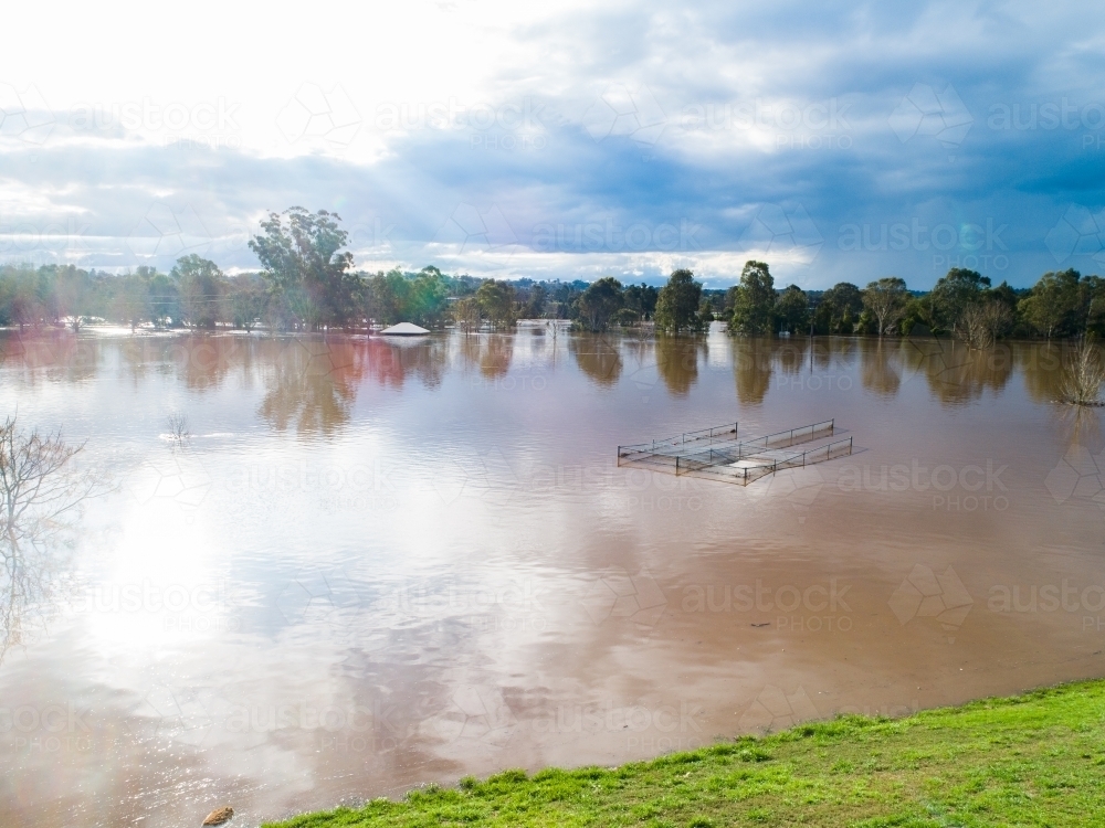 Image of Park sports playing fields covered with floodwater seen from ...