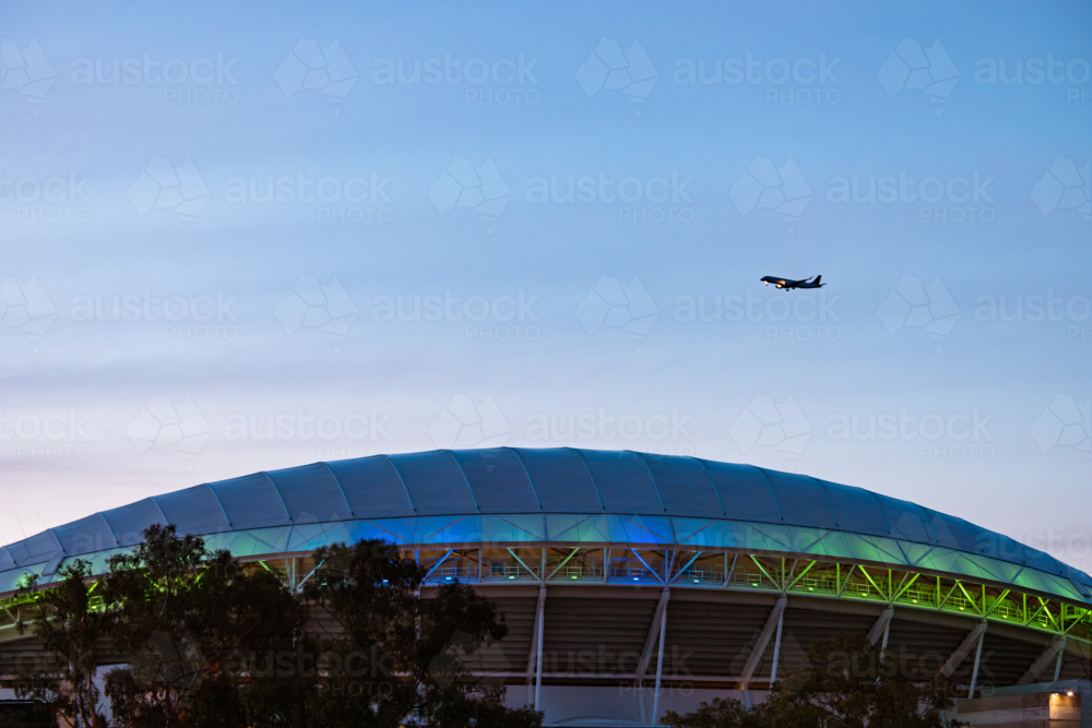 Image of Passenger plane flying over Adelaide Oval in the evening ...