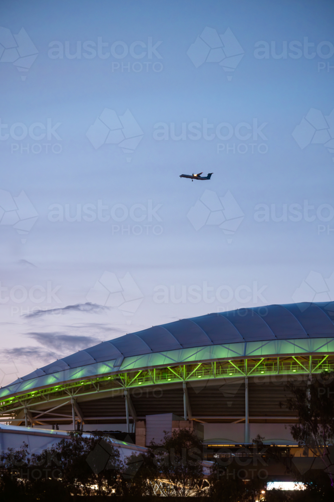Image of Passenger plane flying over Adelaide Oval in the evening ...