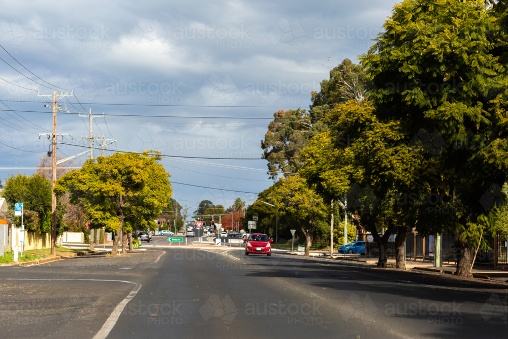 Image of Passenger view down suburban residential street in dubbo with ...