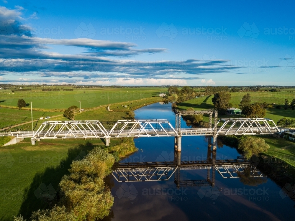 Image of Paterson River and heritage listed bridge in sunlit green ...