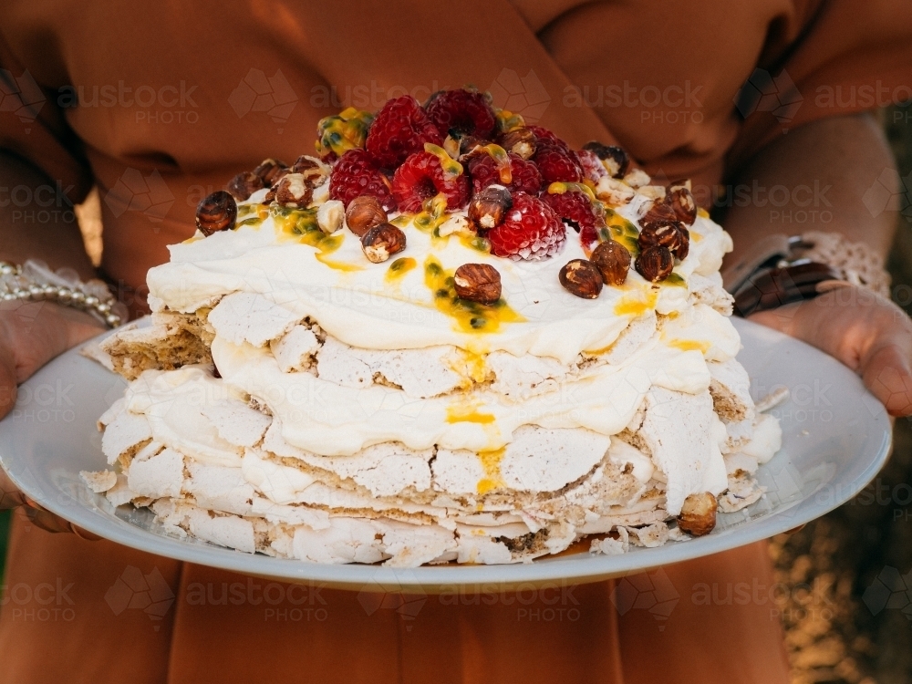 Image of Pavlova with berries and passionfruit - Austockphoto