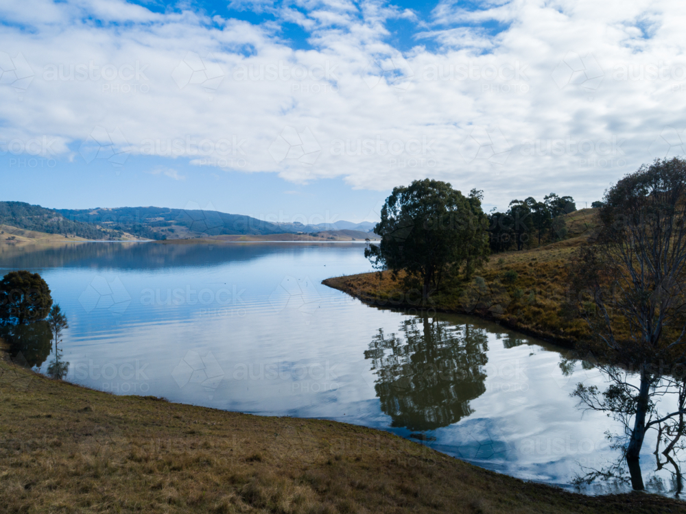 Image of Peaceful lake scenery with sky reflecting in waters in the ...