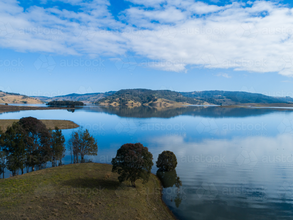 Image of Peaceful lake scenery with sky reflecting in waters in the ...