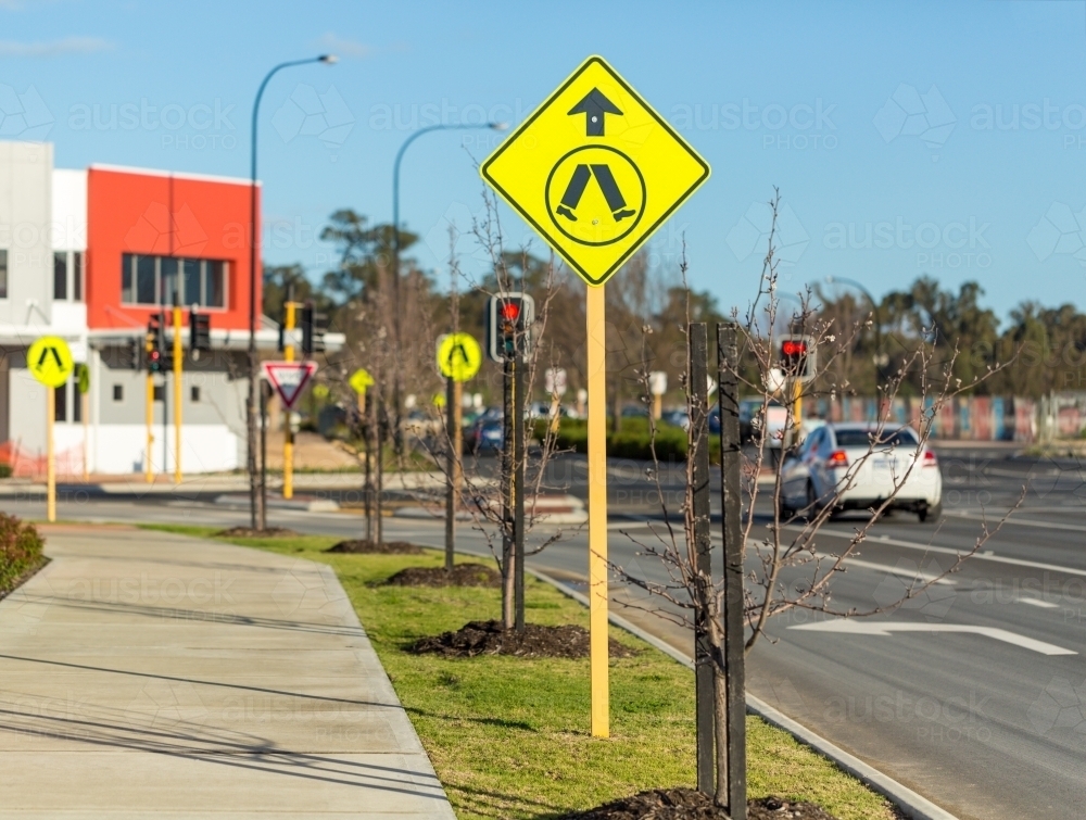 Image of Pedestrian crossing sign on roadside - Austockphoto