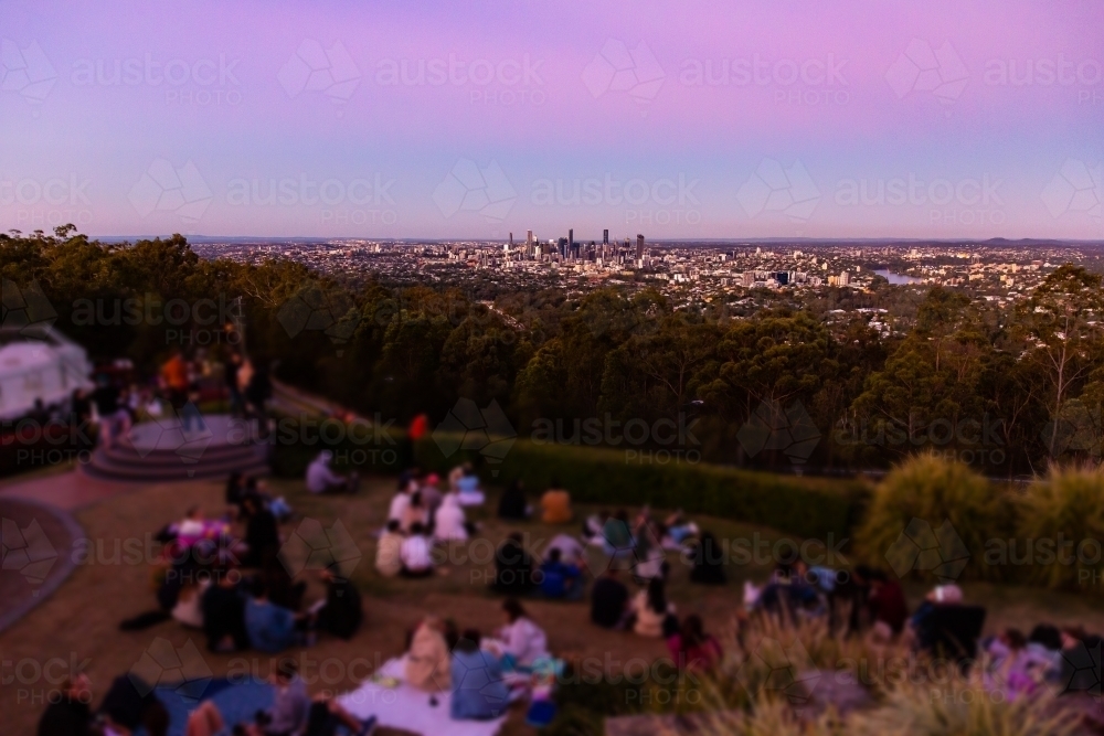 Image of people watching the sunset from the Mount Coot-tha lookout ...