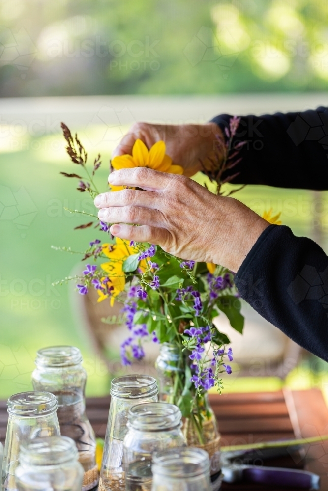 Image of Person making flower arrangement for wedding with sunflower ...