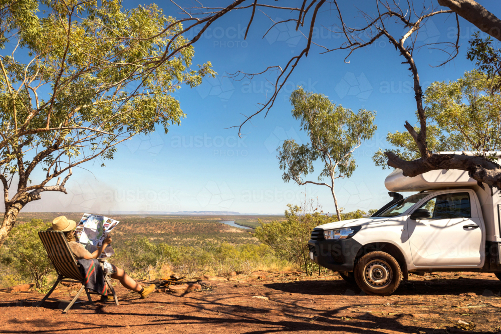 Image of person relaxing in chair camping in Australian outback ...