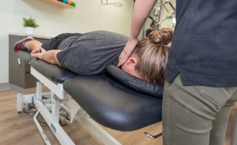 Image of Physiotherapy session with practitioner and patient - Austockphoto