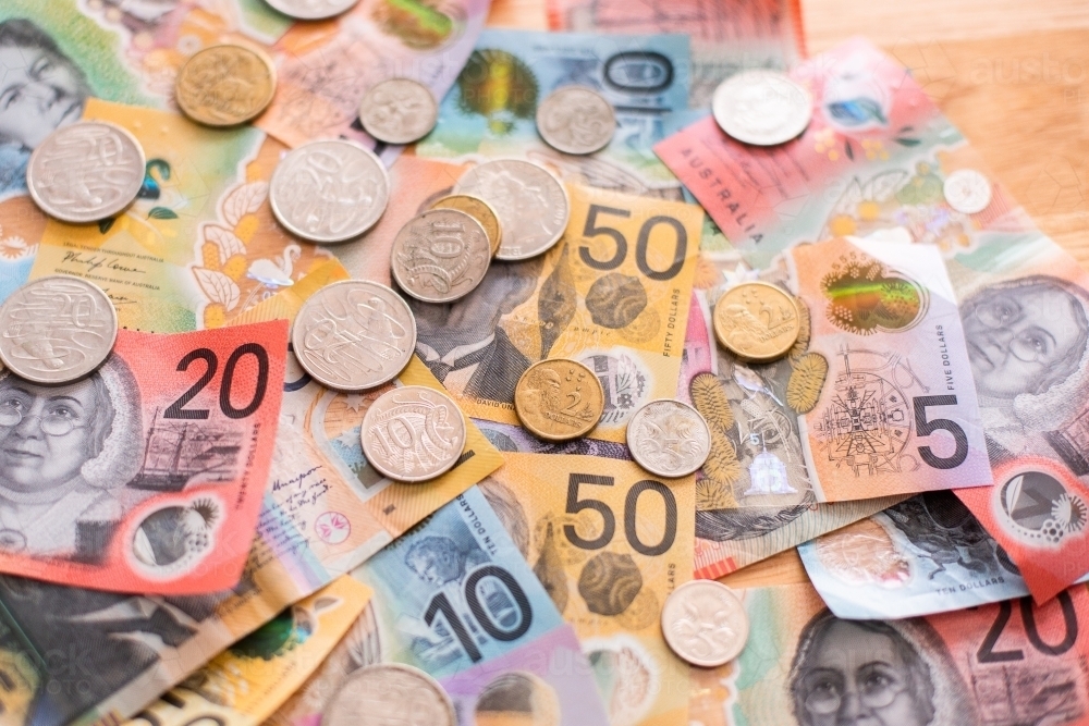 Image of pile of assorted Australian currency including notes and coins ...