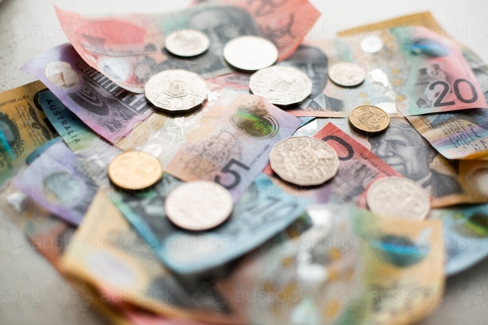Image of Pile of Australian money on a white background - Austockphoto