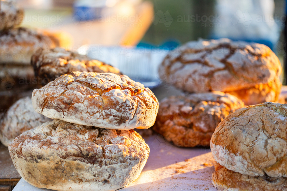 Image of Pile of camp oven johnny cooked damper bread - Austockphoto
