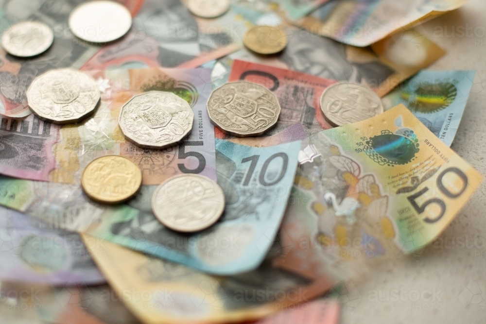 Image of pile of different notes and coins aussie currency - Austockphoto